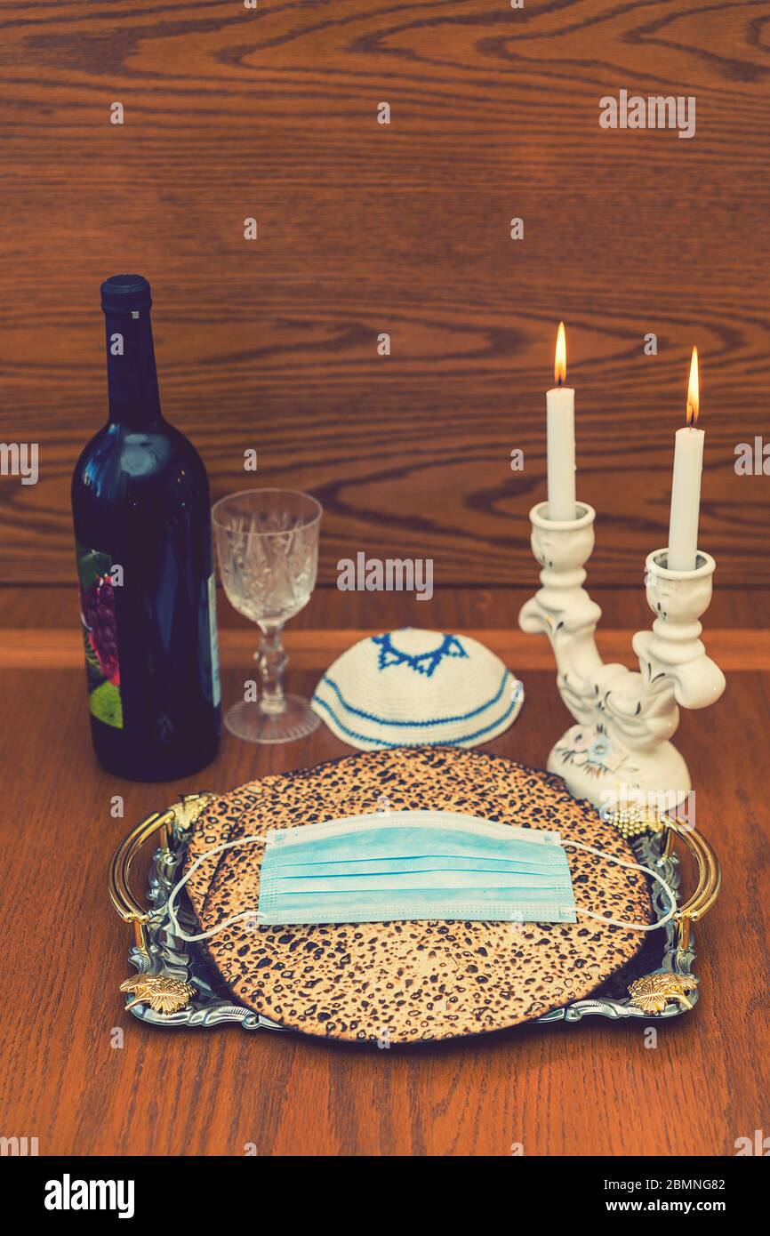 Corona Passover. Dust mask, bottle of wine and matzah - a traditional ...