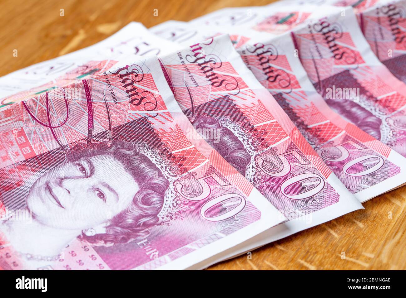 Fifty pound notes stacked up, £50 notes pound sterling Stock Photo - Alamy