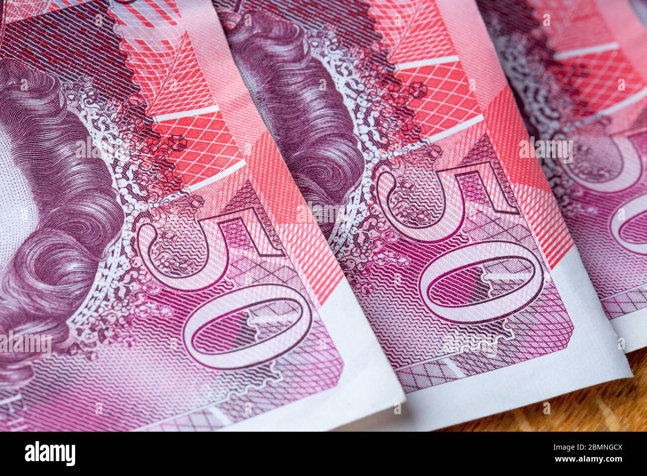 Fifty pound notes stacked up, £50 notes pound sterling Stock Photo - Alamy