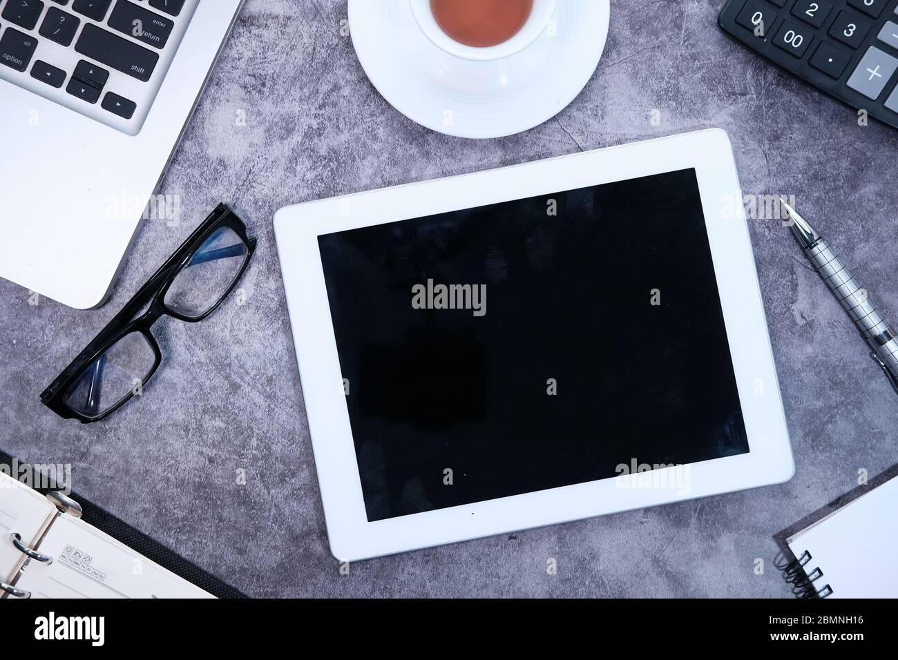 Top view of digital tablet, laptop and notepad on table Stock Photo - Alamy