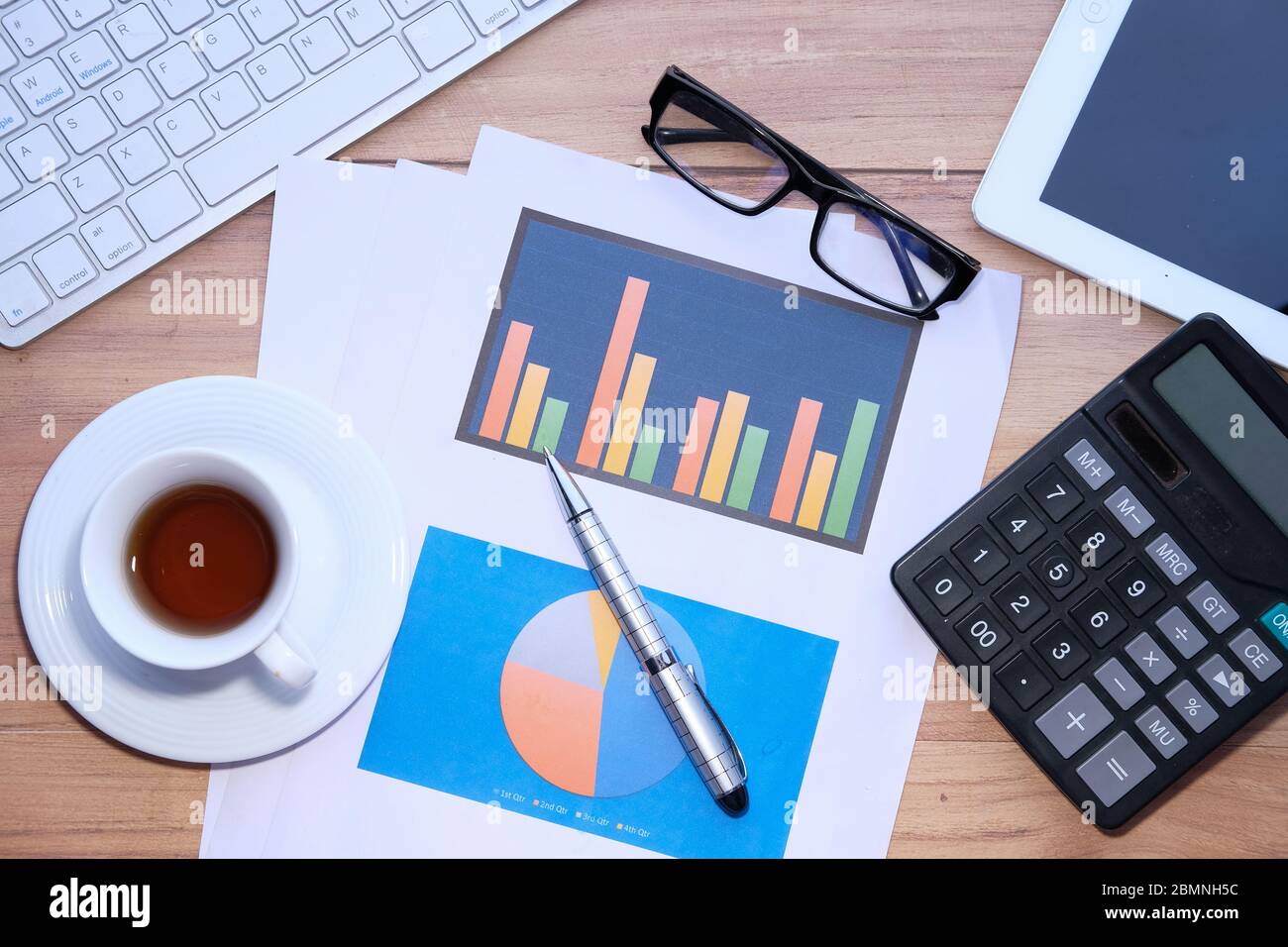 Top view of financial chart and pens on table Stock Photo - Alamy