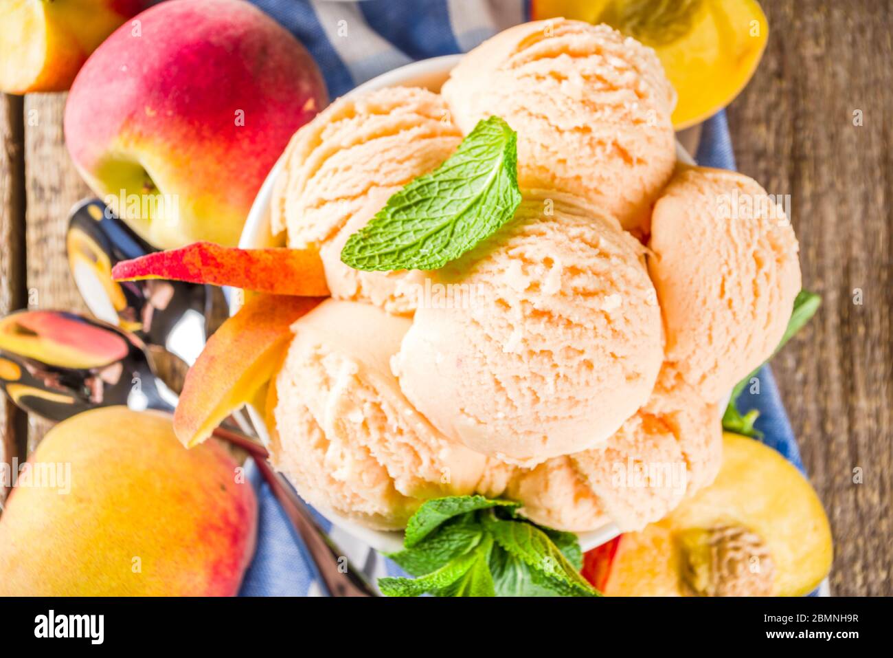 Homemade sweet peach ice cream. Peach gelato balls in small bowls, on ...