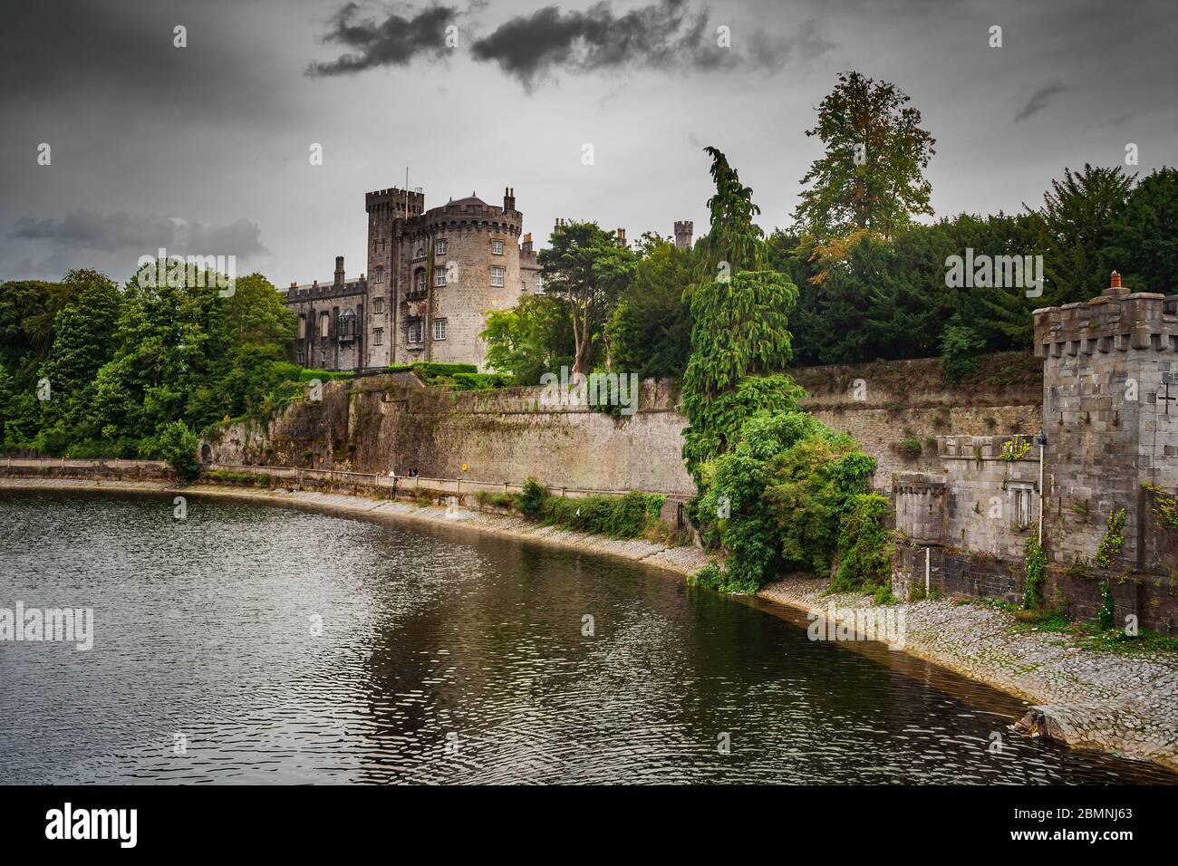 Kilkenny Castle by the River Nore in Ireland, medieval city landmark ...