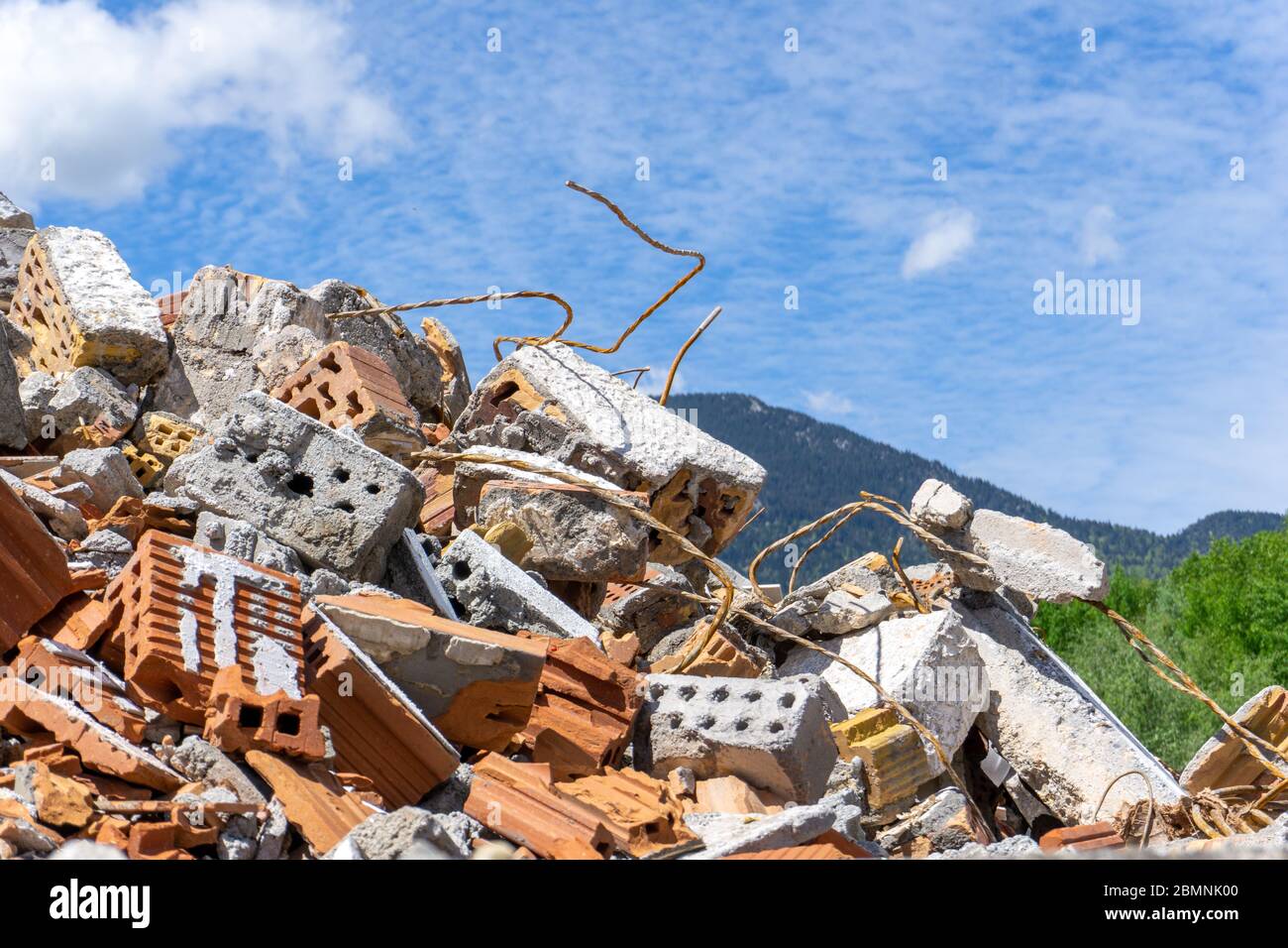 large piles of rubble and broken bricks and cinder blocks from ...