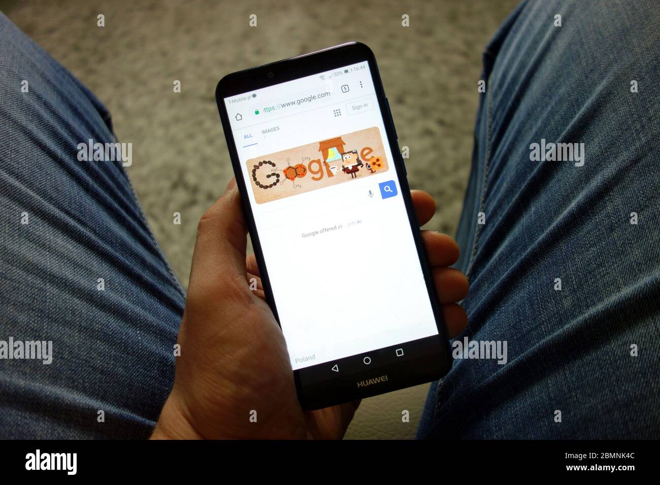 Man holding Huawei smartphone with Google search website displayed ...