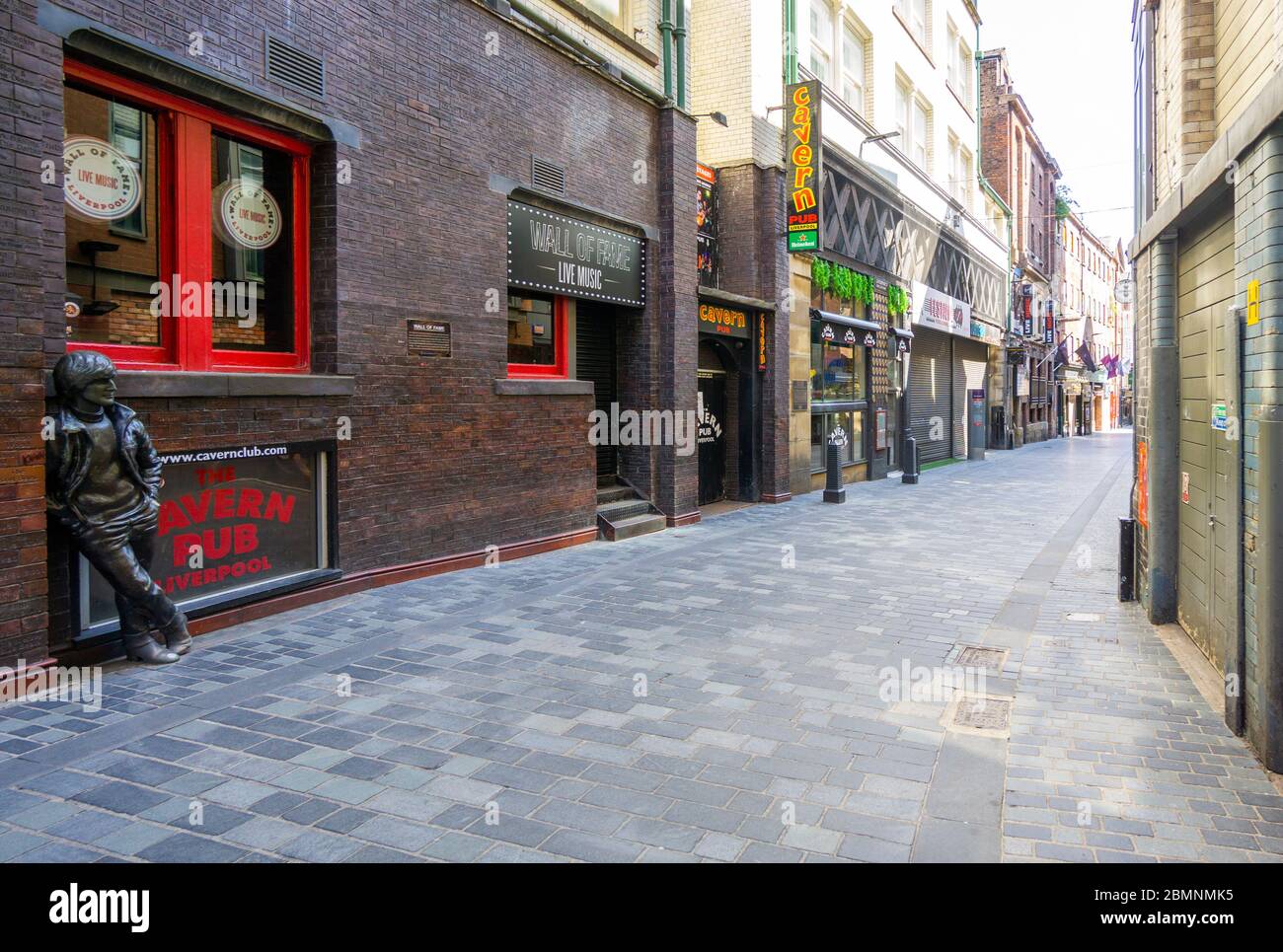 John Lennon statue looks out on an empty Mathew Street due to the ...
