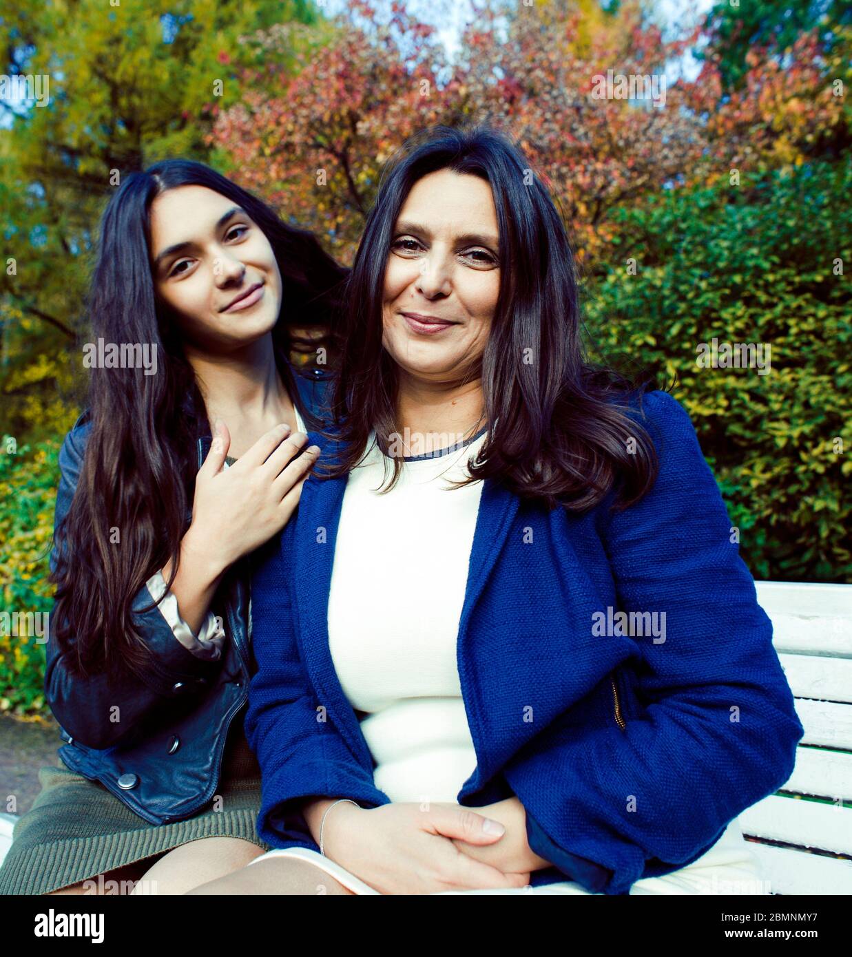 mature real mother with daughter outside autumn fall in park ...