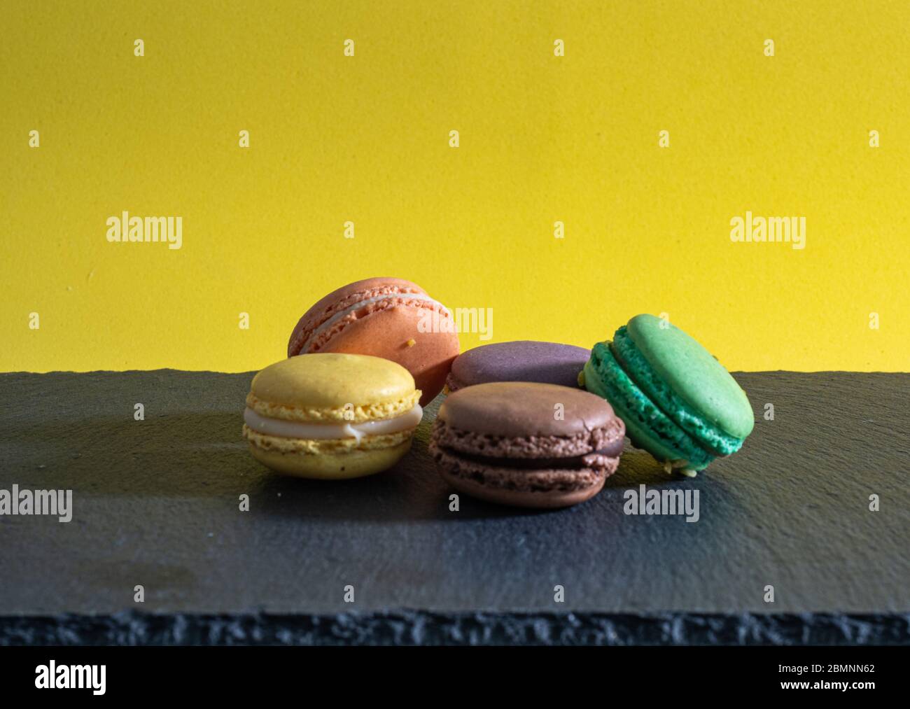 Home made still life with yellow plain background and coloured ...