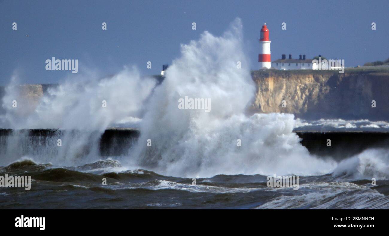 Waves crash against Tynemouth pier wall, in South Shields with Souter ...
