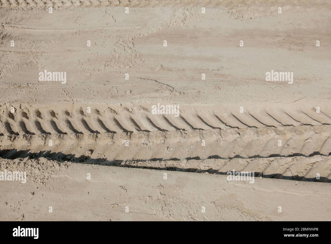 Tire tracks in the sand of a beach Stock Photo - Alamy