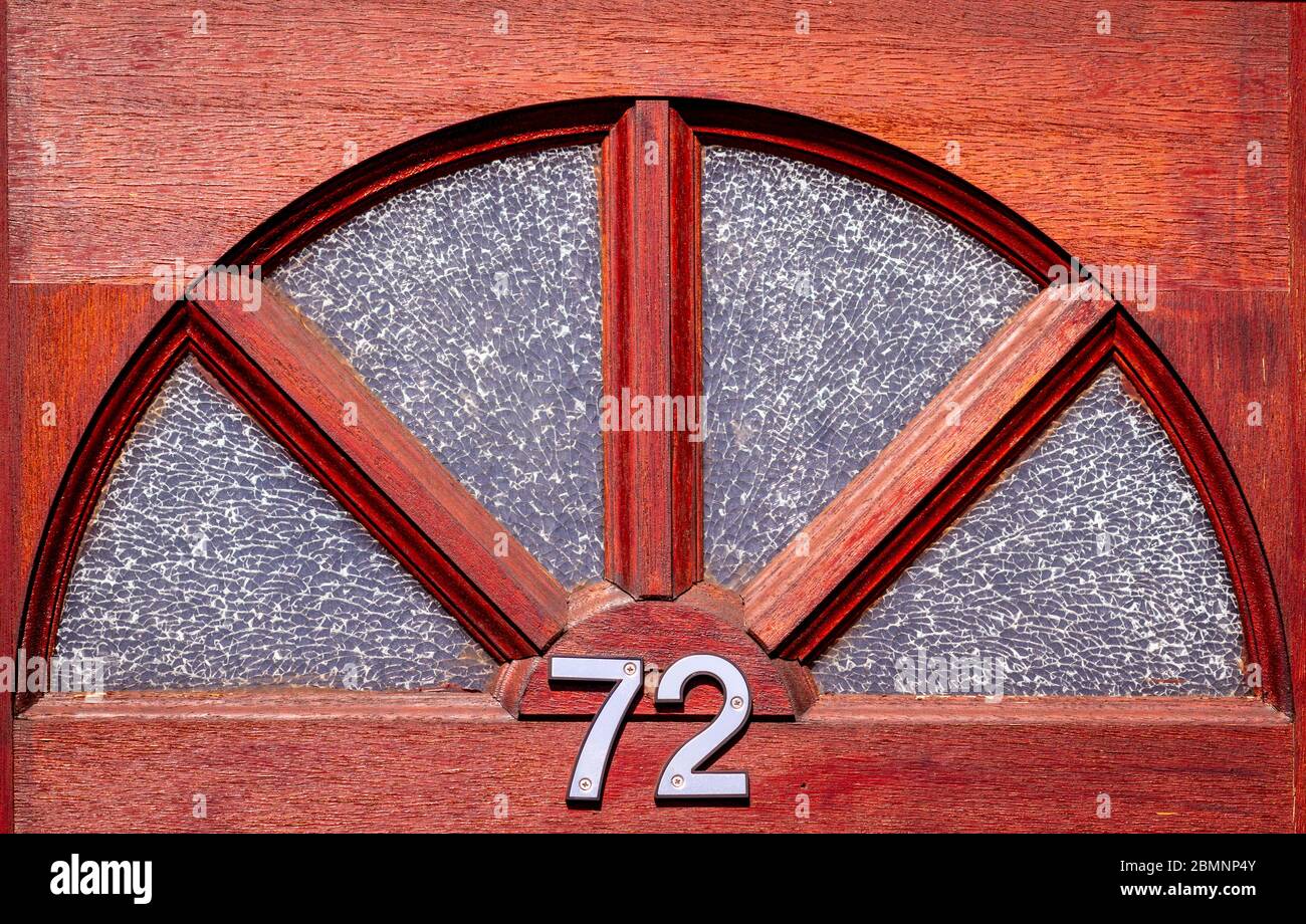 House number 72 under a semicircle of broken glass Stock Photo - Alamy