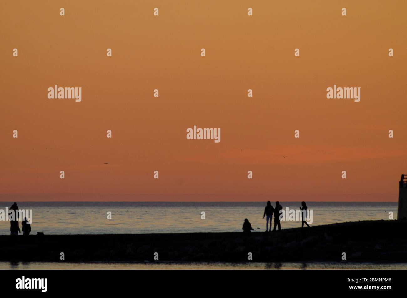People on the beach at dusk in Alexandroupoli Greece Stock Photo - Alamy