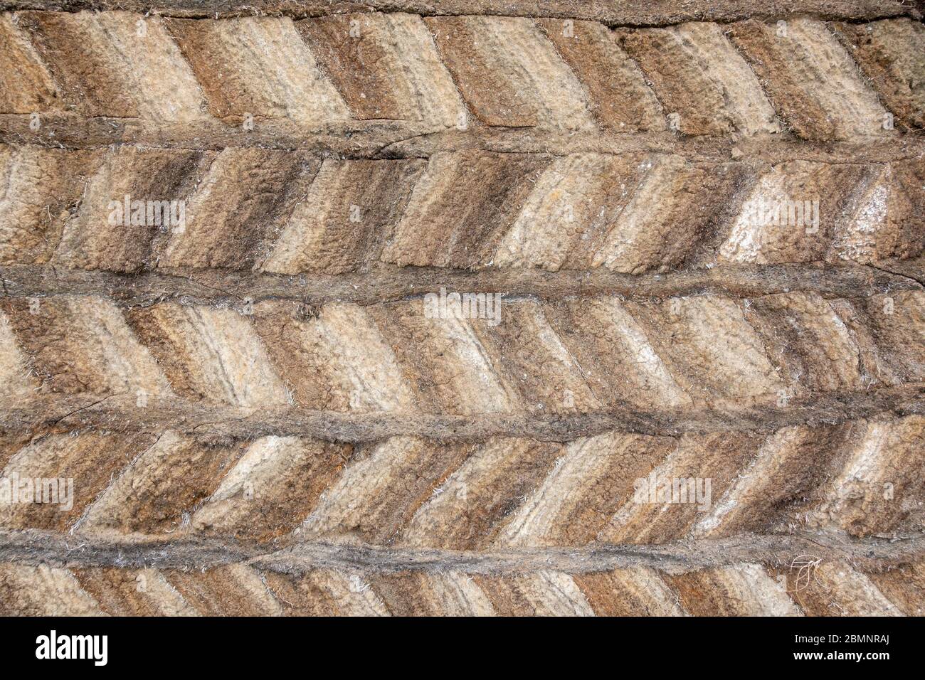 Detail showing the layers of turf at the back of farm buildings ...