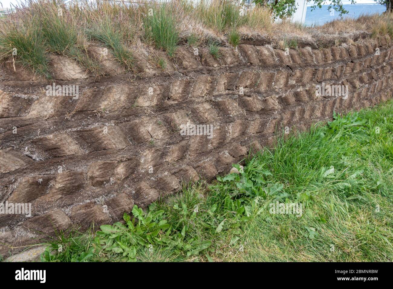 Detail showing the layers of turf at the back of farm buildings ...