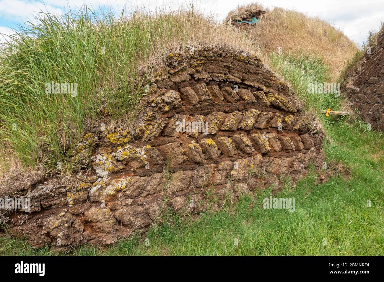 Detail showing the layers of turf at the back of farm buildings ...