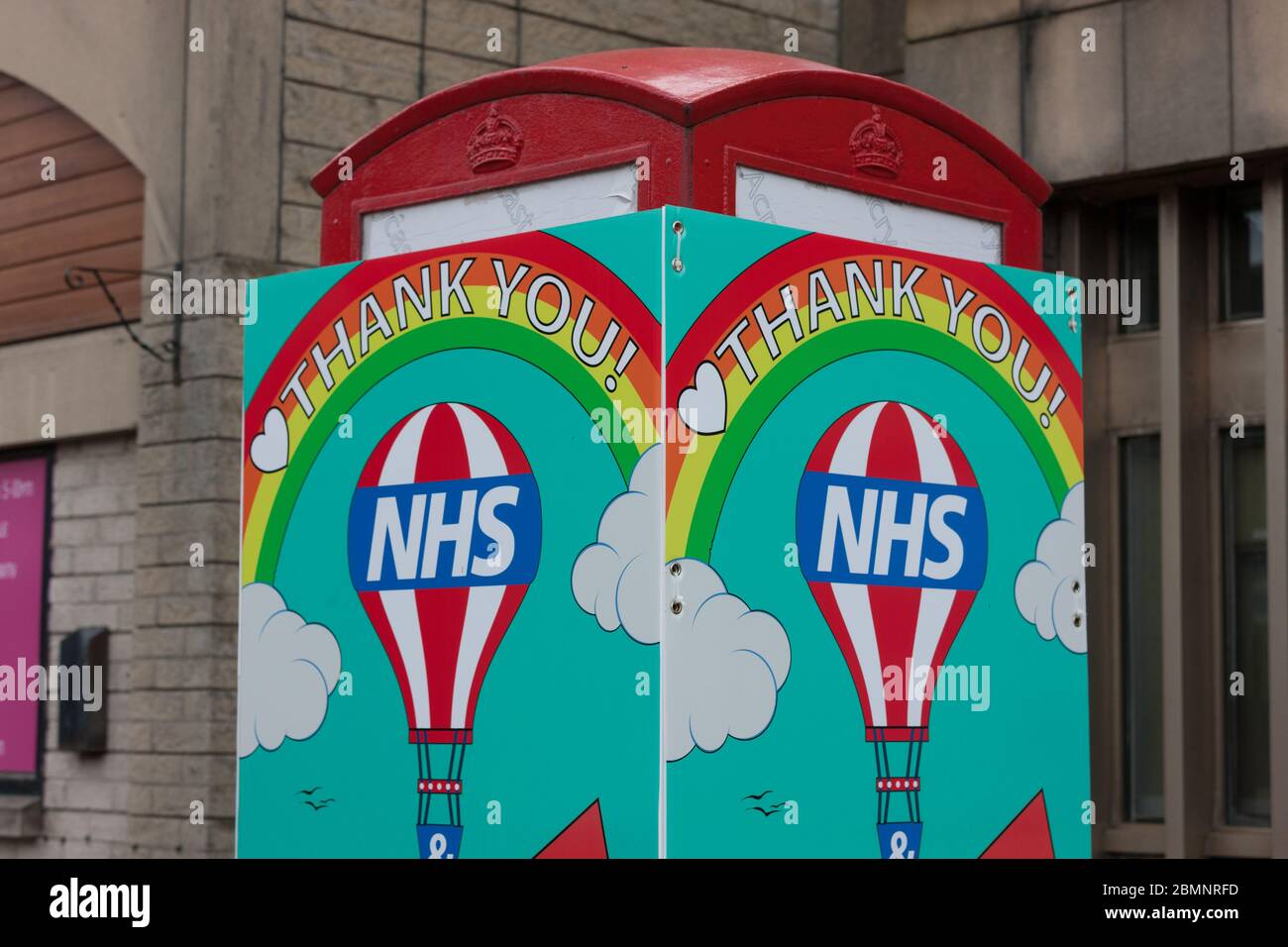 Meltham, UK - May 5 2020: A red phone box clad in graphics thanking NHS ...