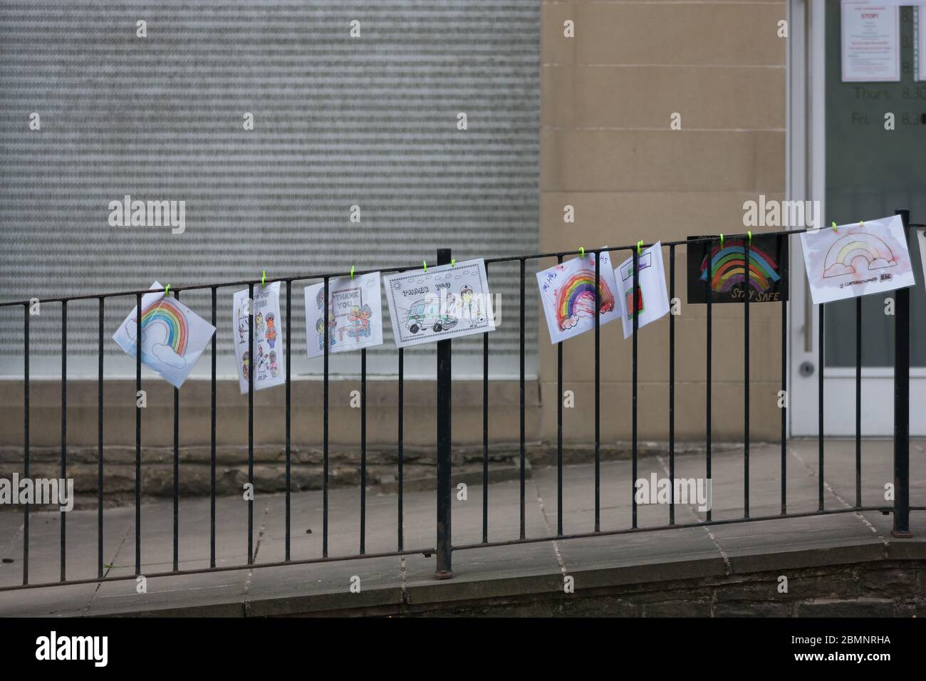 Meltham, UK - May 5 2020: Children's drawings of rainbows in the town ...
