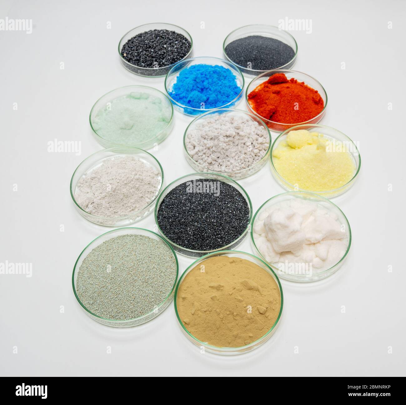 Examples of dry bulk chemical elements in petri dishes on a white ...