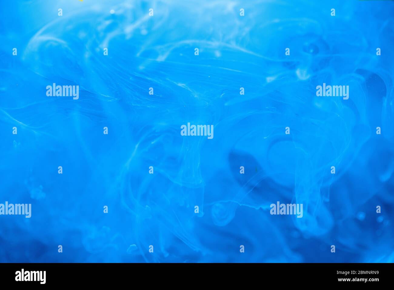 Abstract blue background. Liquid background with floating blue paint in ...