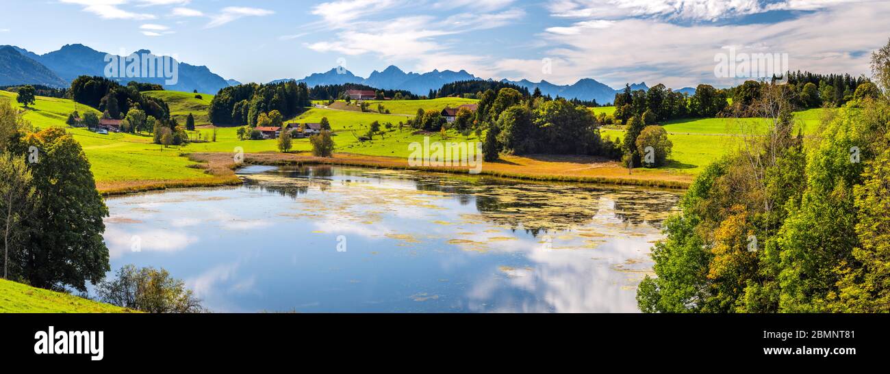 panoramic landscape with lake and mountains Stock Photo - Alamy