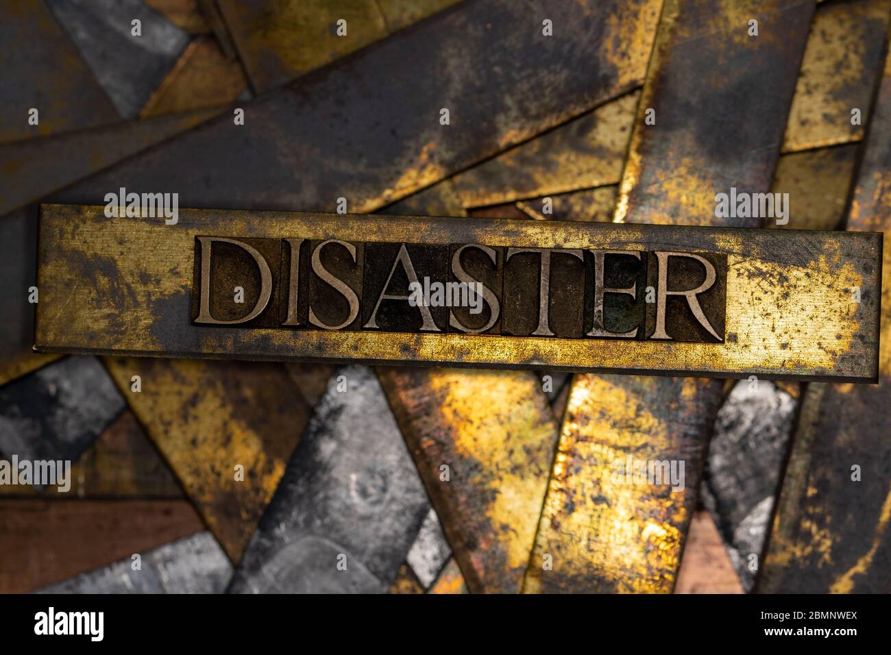 Photo of real authentic typeset letters forming Disaster text on ...