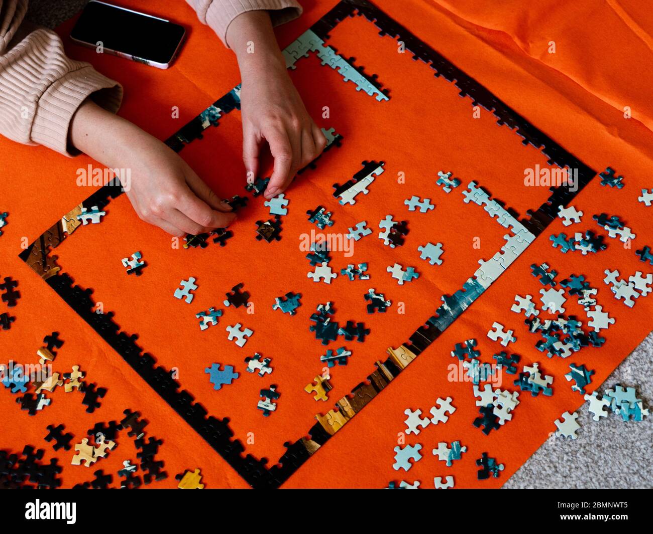 Woman Doing Jigsaw Puzzle High Resolution Stock Photography and Images ...
