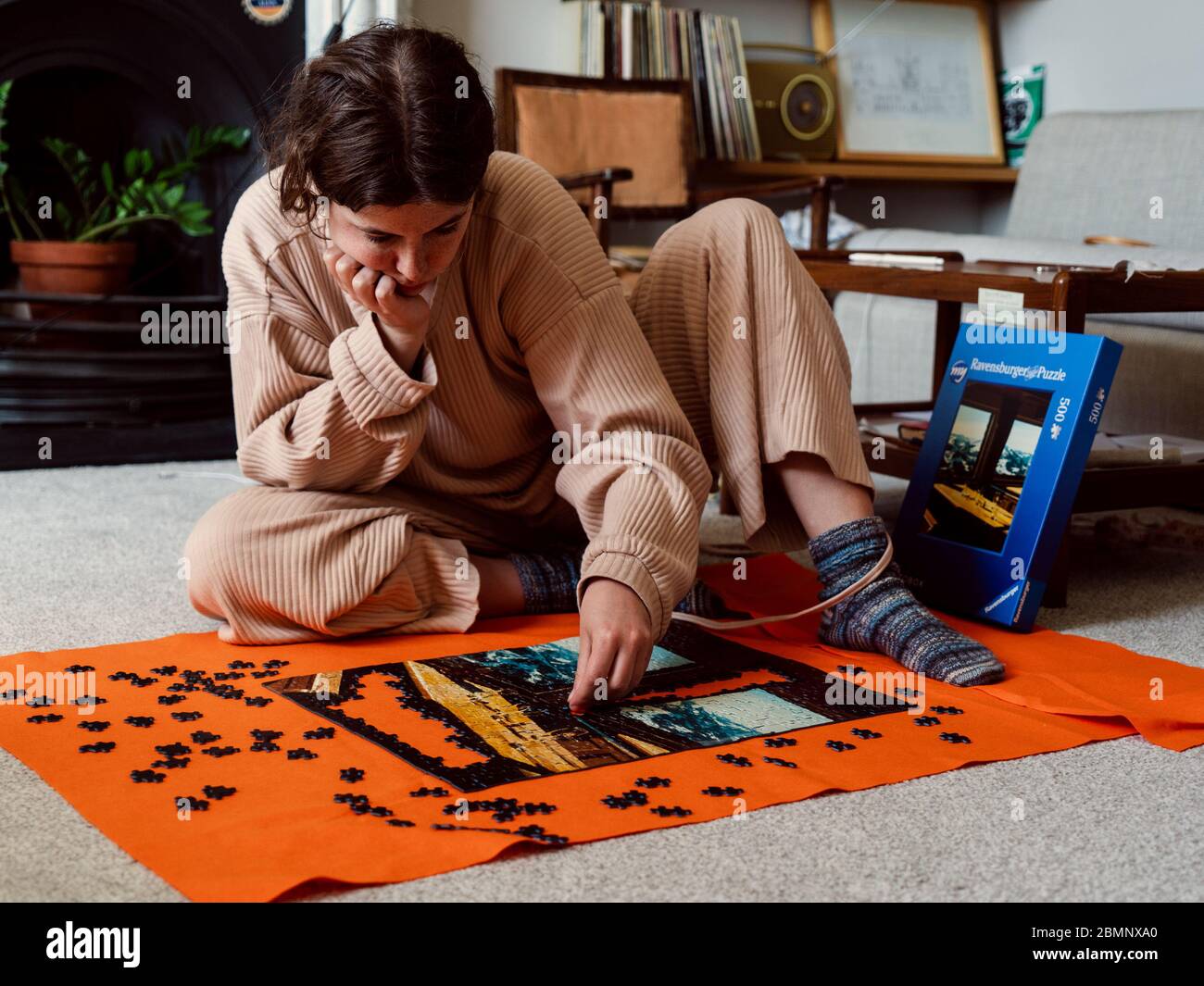 Woman Doing Jigsaw Puzzle High Resolution Stock Photography and Images ...