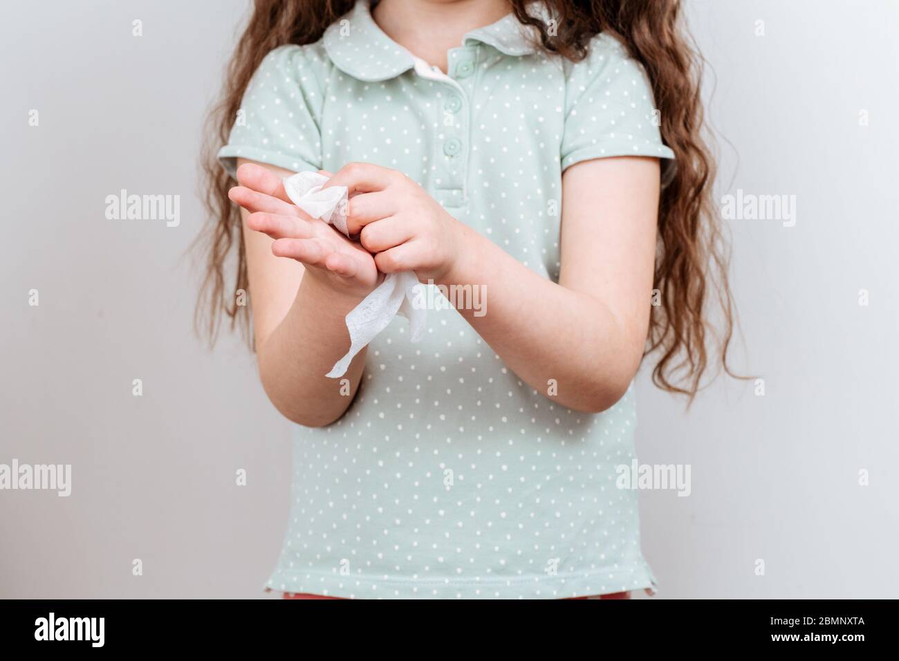 The child wipes her hands wet antibacterial wipe. The fight against ...