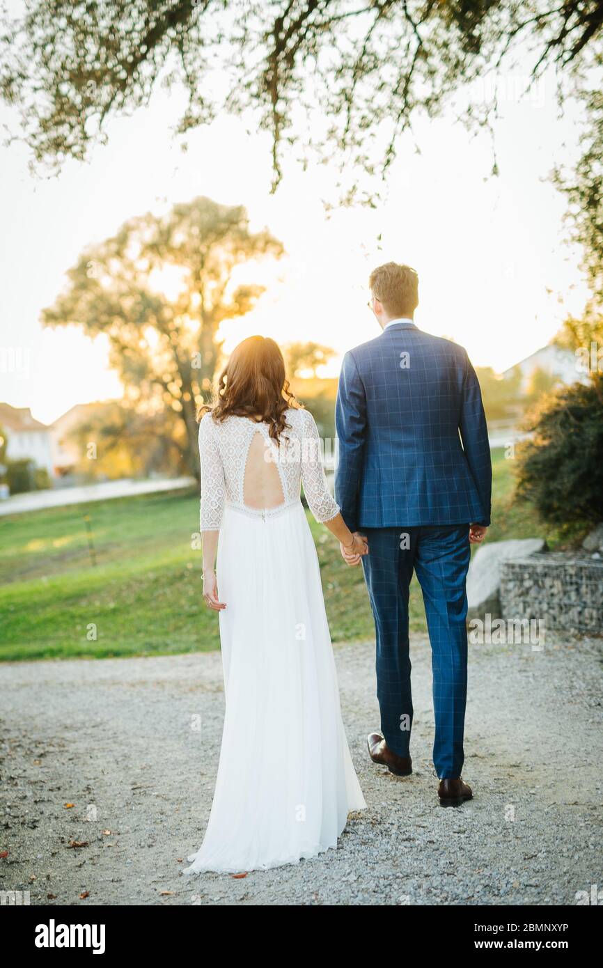 Bride and groom walking together Stock Photo - Alamy