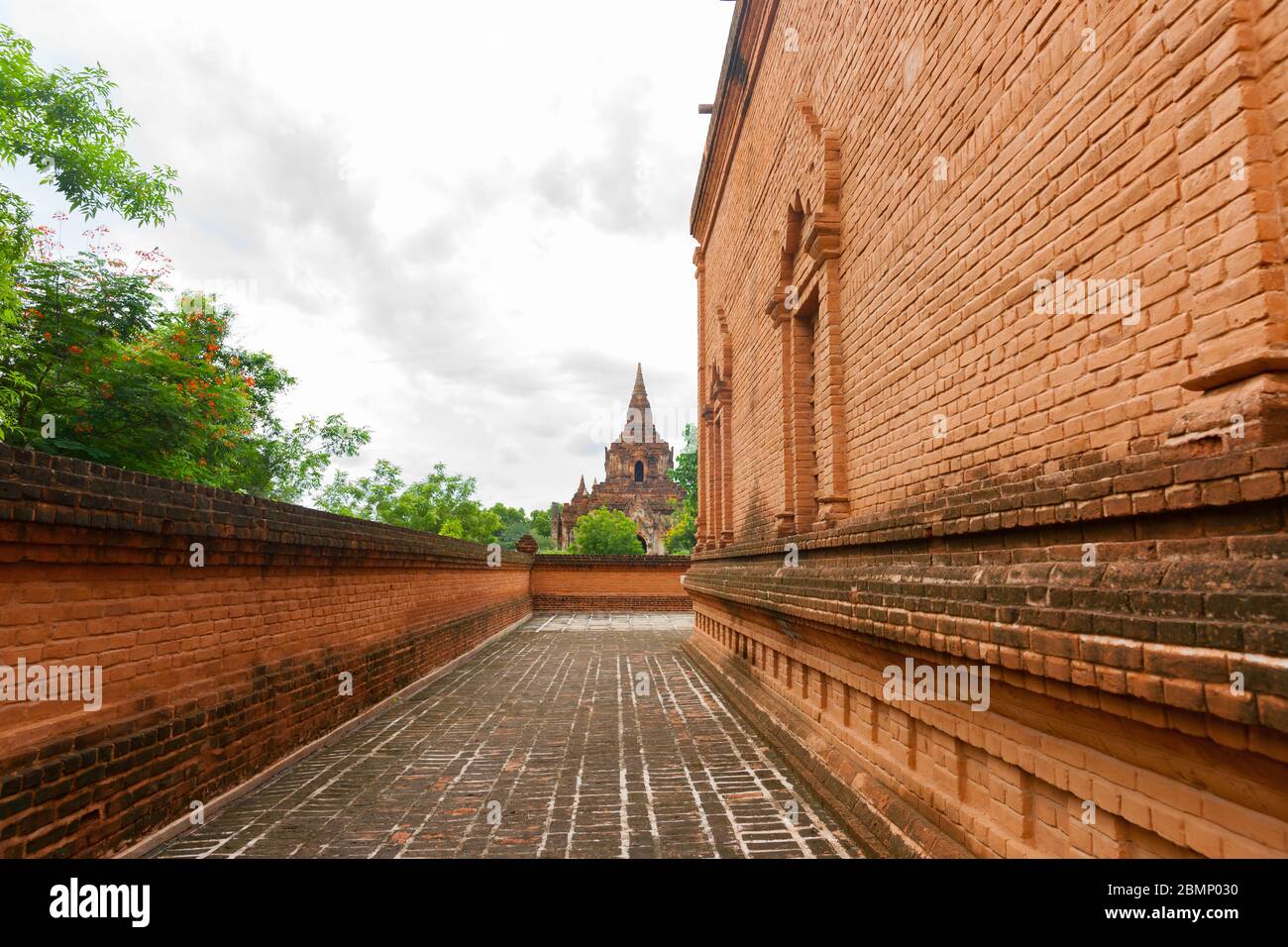 Myanmar travel image brick architecture with long wall and path leading ...