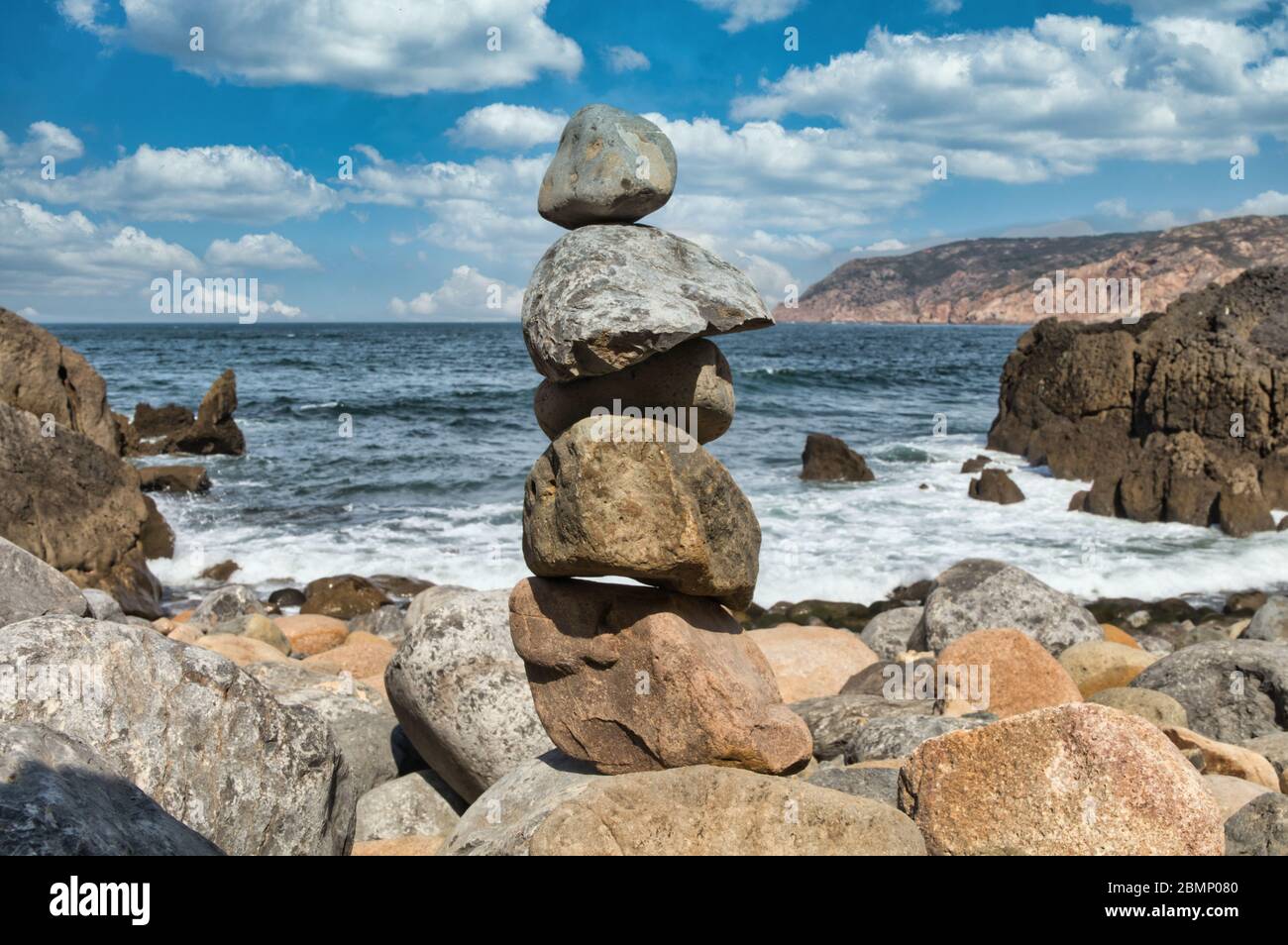 Stacked rocks on a pebble beach Stock Photo - Alamy