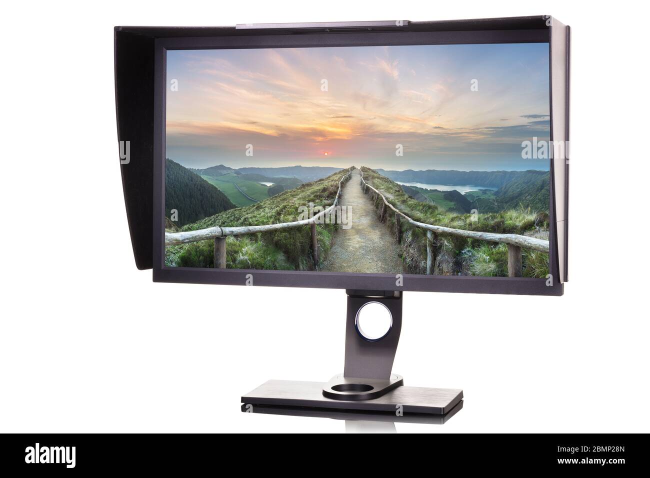 Professional photographer monitor with shading hood isolated on white ...