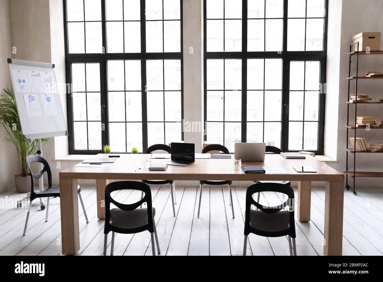 Concept of empty modern loft office space with wooden table Stock Photo ...