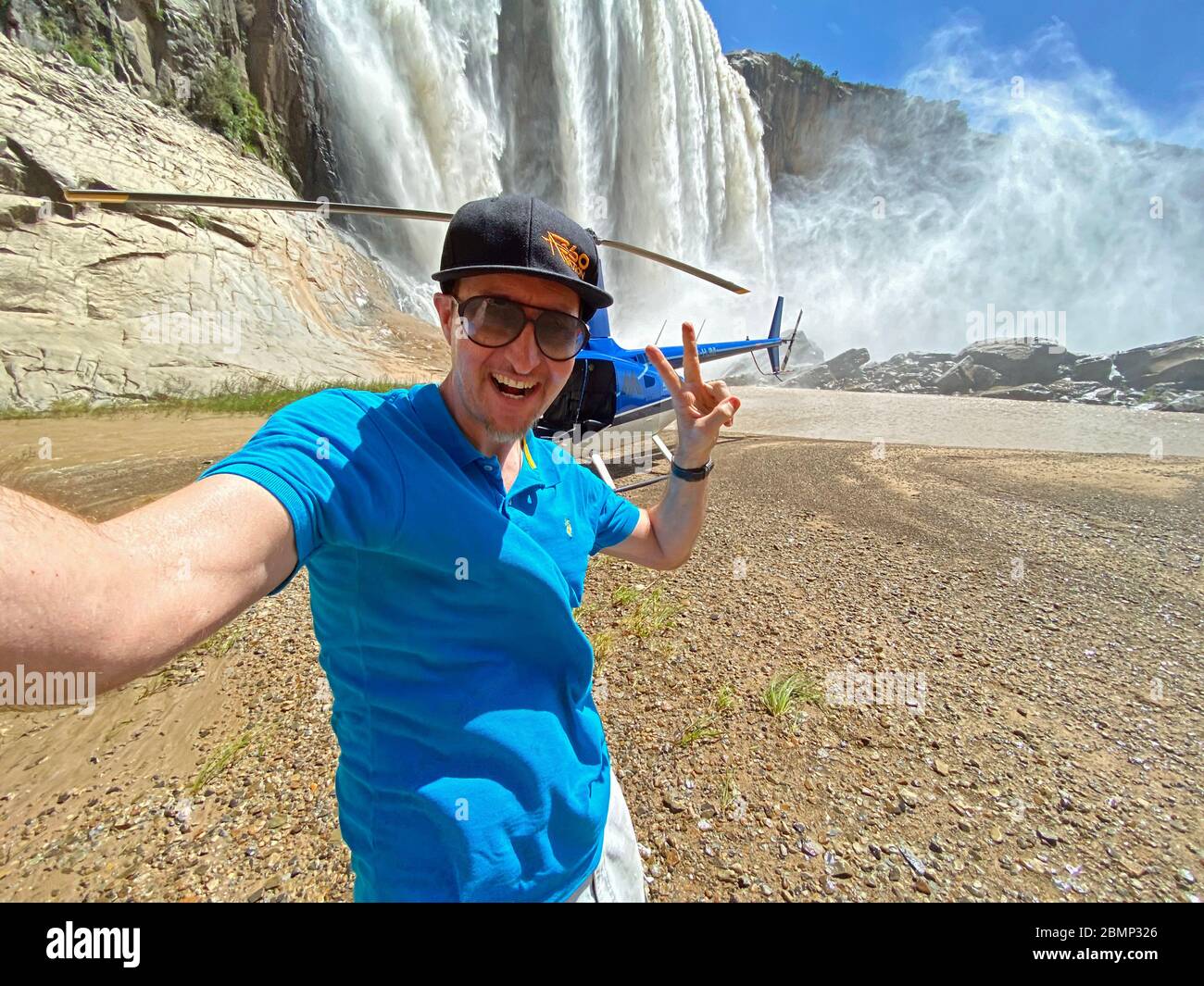 The pilot is very happy that he landed safely with his helicopter on ...