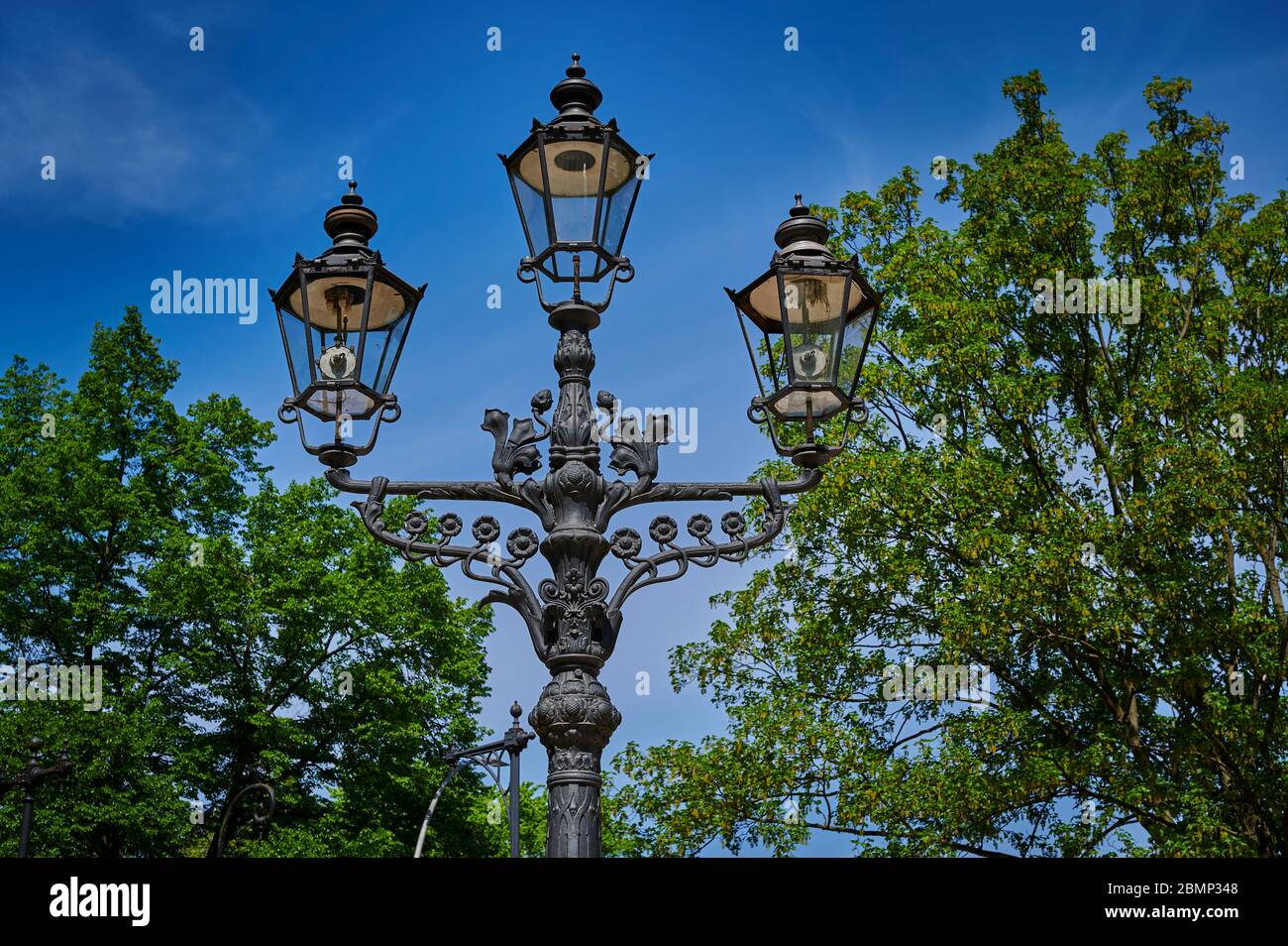 Historic and still functional street lamp that is powered by gas and ...