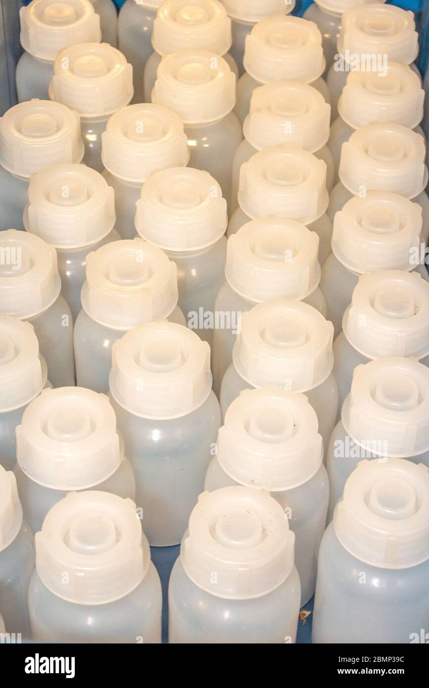 Sorted plastic sampling bottles in a box, ready for industrial use ...