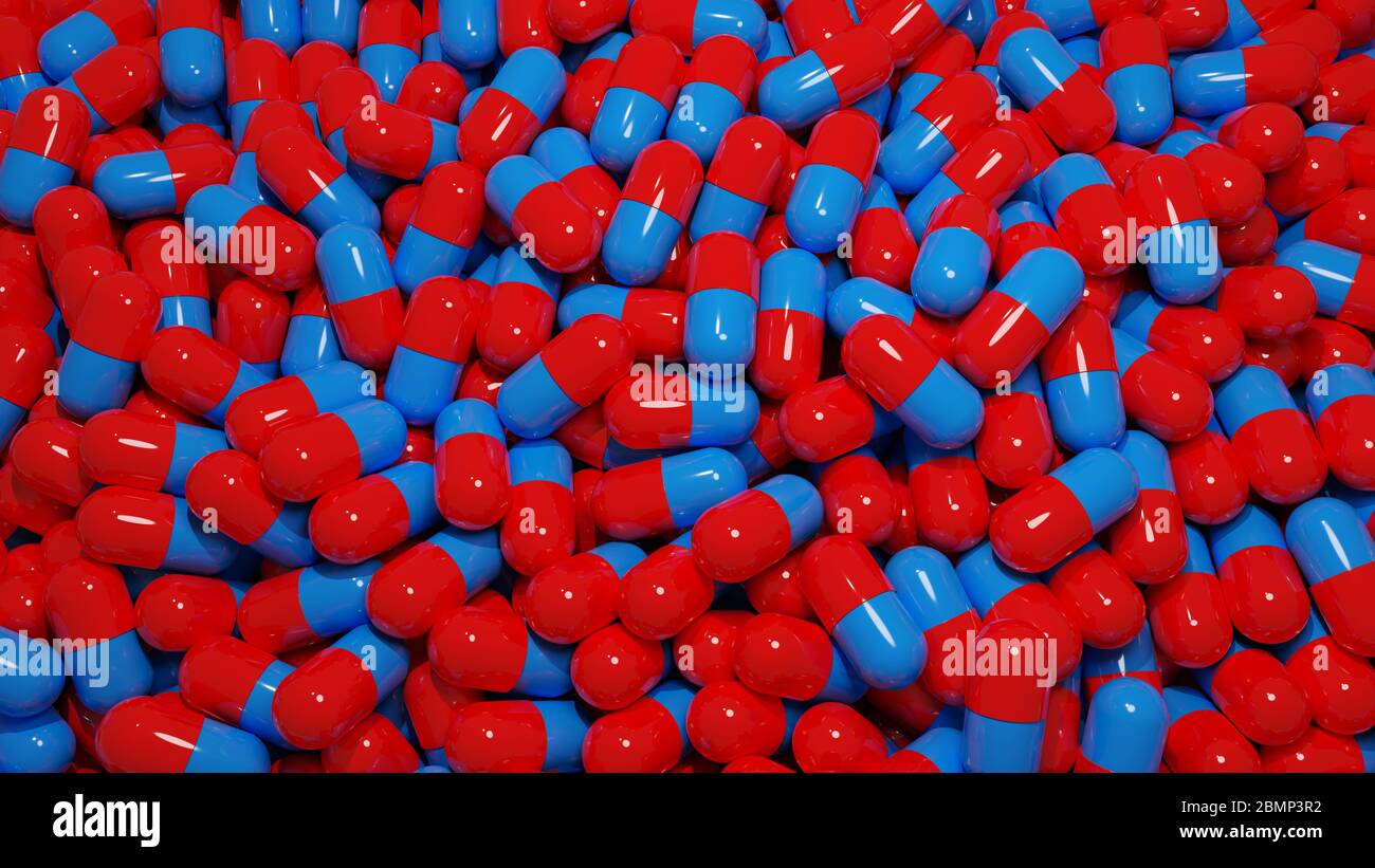 large number of two-color medical capsules Stock Photo - Alamy