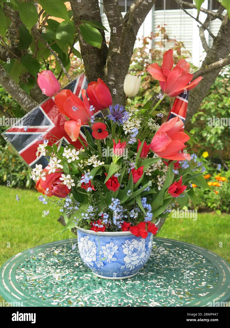 A red, white & blue floral arrangement incorporating a poppy and Union ...