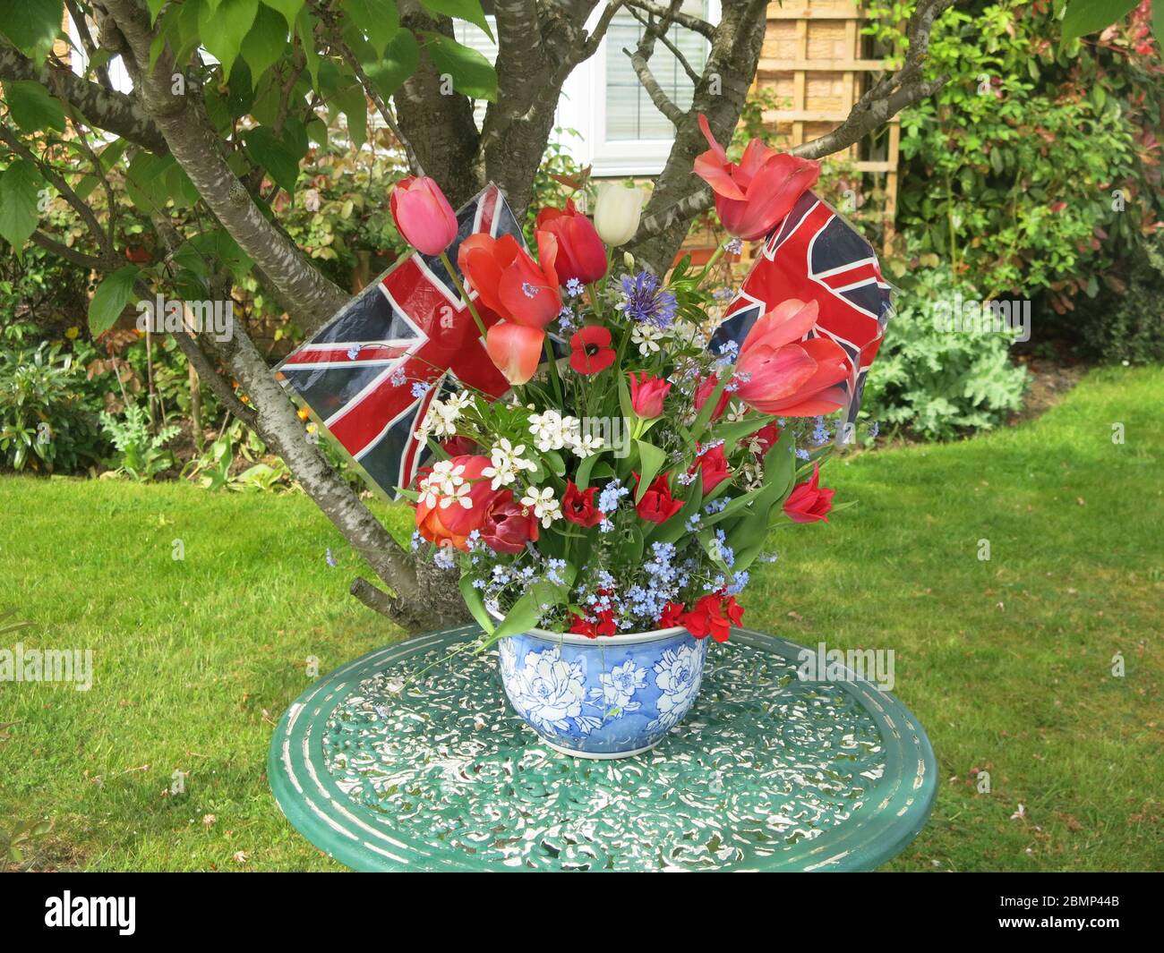 A red, white & blue floral arrangement incorporating a poppy and Union ...