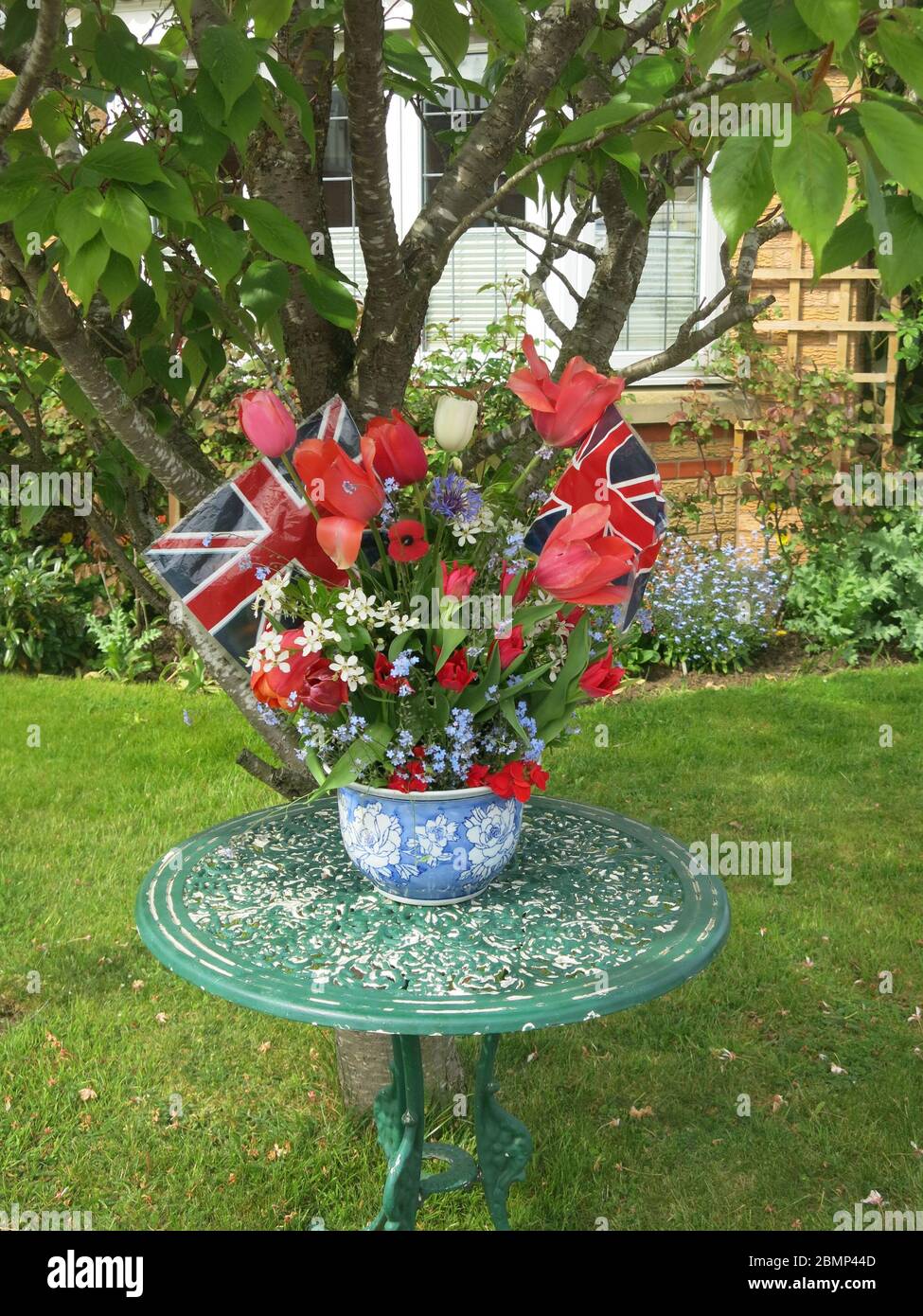 A red, white & blue floral arrangement incorporating a poppy and Union ...