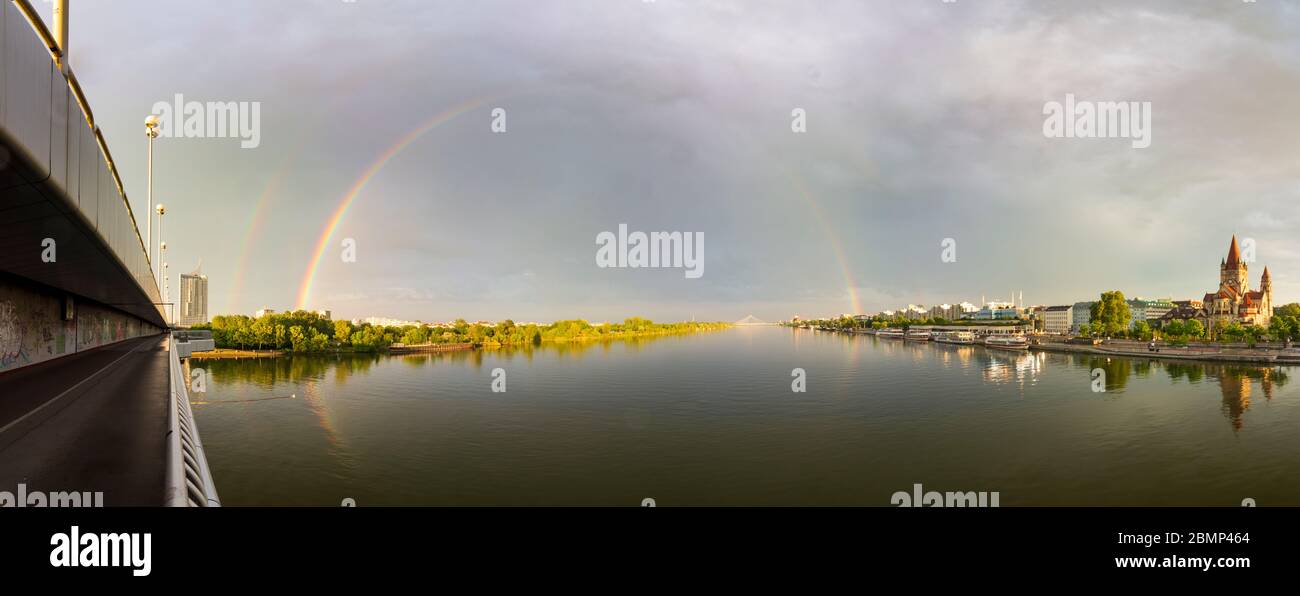 Wien, Vienna: double rainbow above river Donau (Danube), high-rise ...
