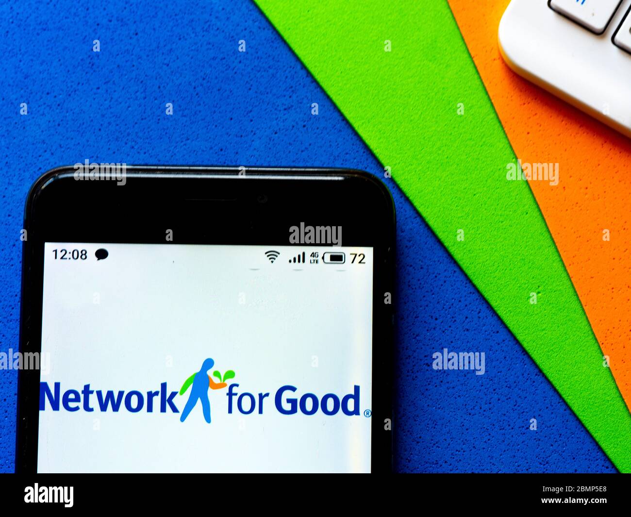 In this photo illustration a Network for Good logo seen displayed on a ...