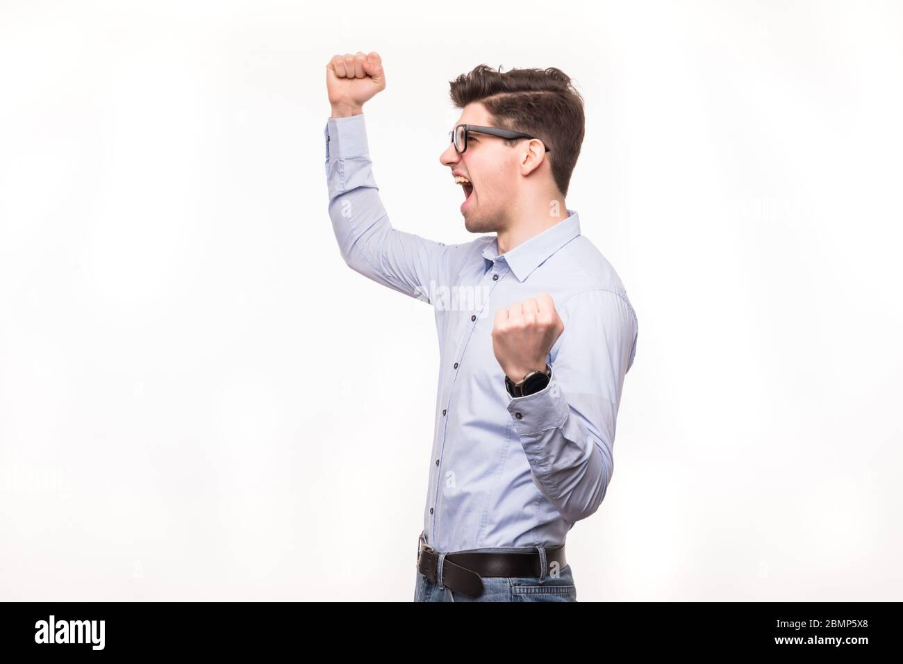 Successful young businessman celebrating his victory isolated on white ...