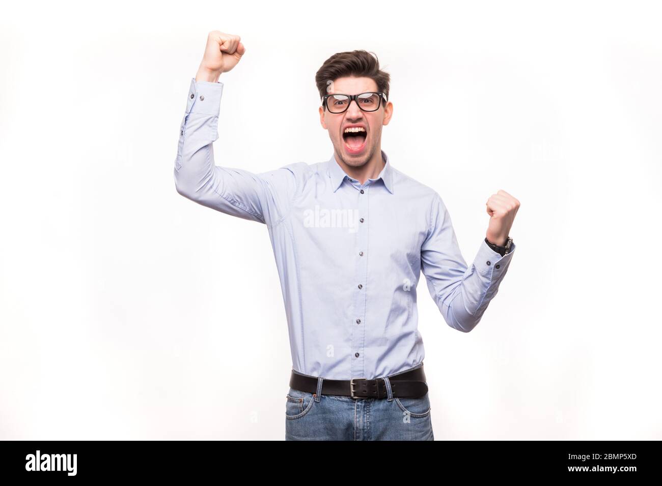 Successful young businessman celebrating his victory isolated on white ...
