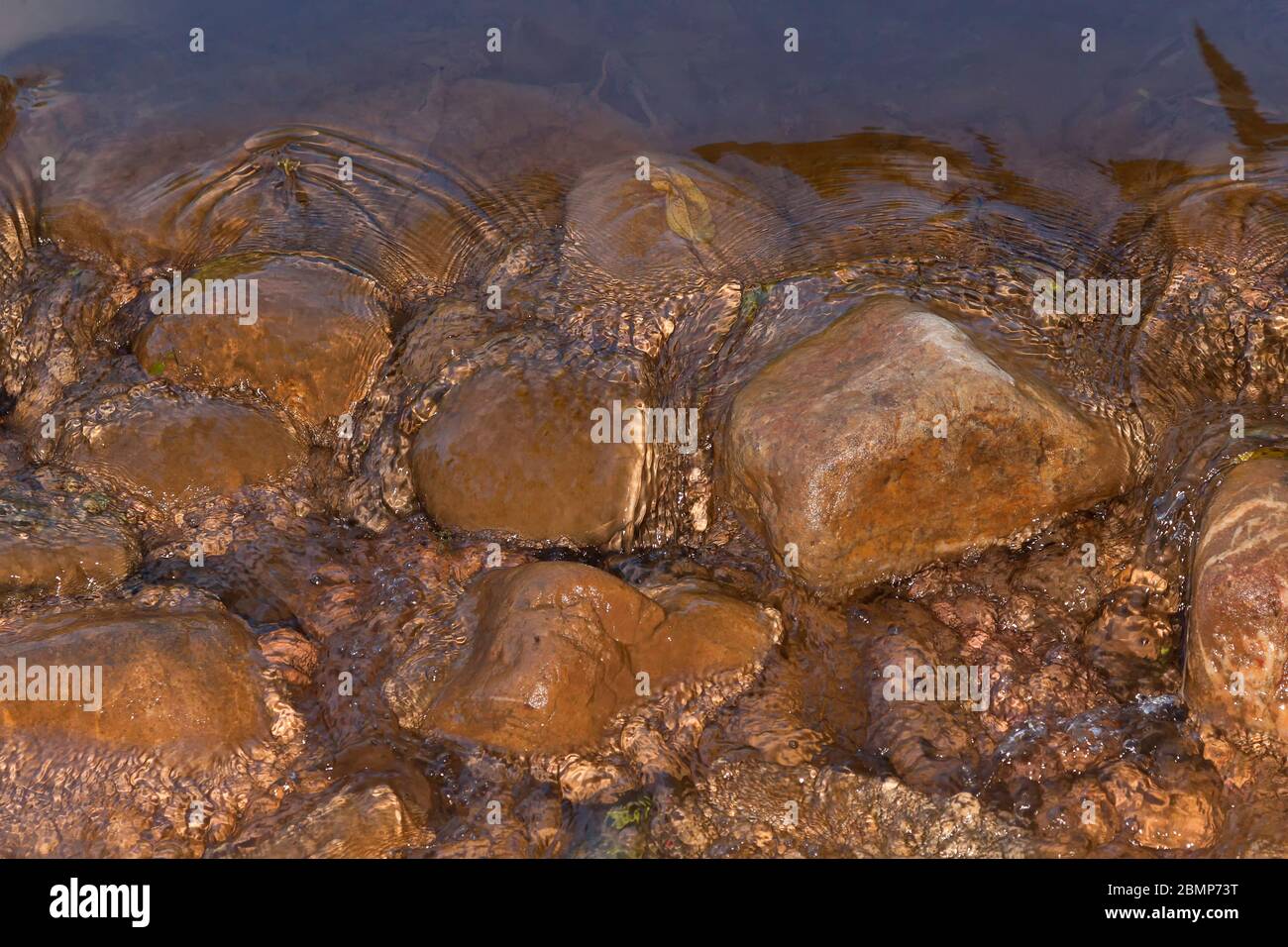 Water flowing through rocks Stock Photo - Alamy