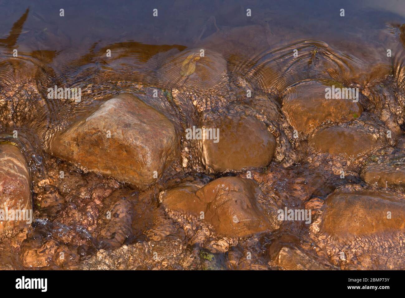 Water flowing through rocks Stock Photo - Alamy