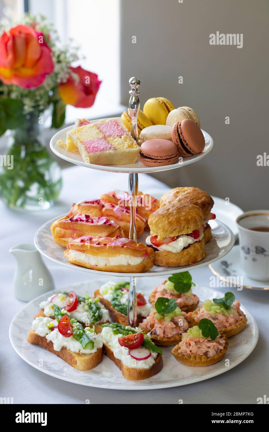 Traditional afternoon tea with canapes and cakes Stock Photo - Alamy