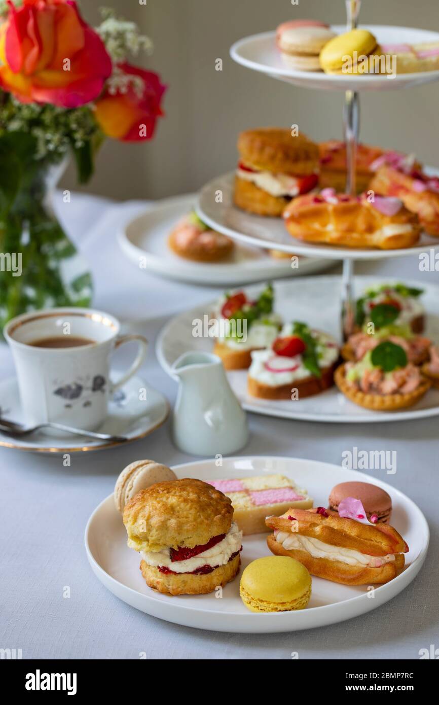 Traditional afternoon tea with canapes and cakes Stock Photo - Alamy