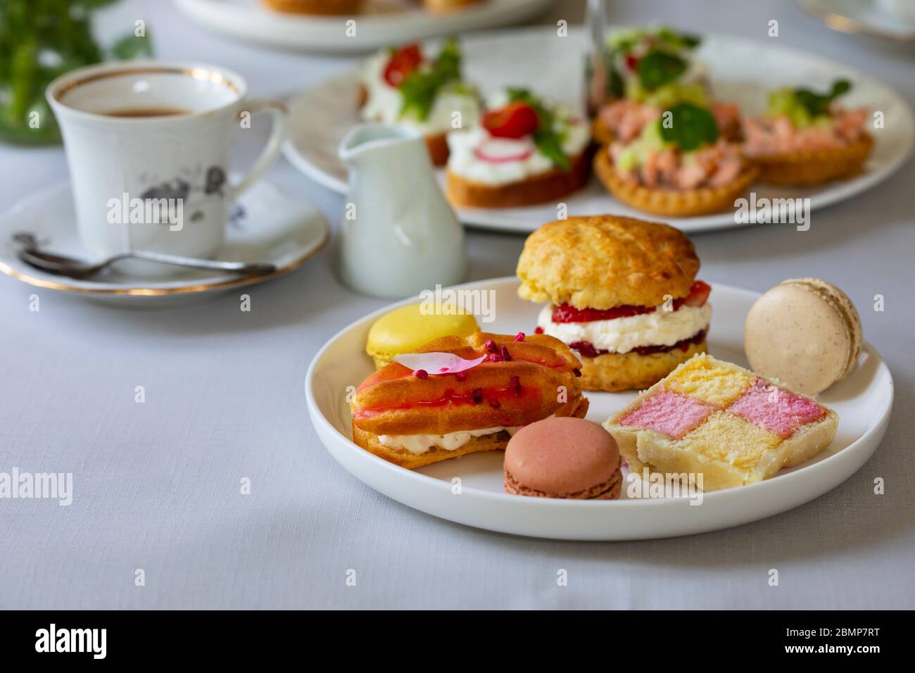 Traditional afternoon tea with canapes and cakes Stock Photo - Alamy