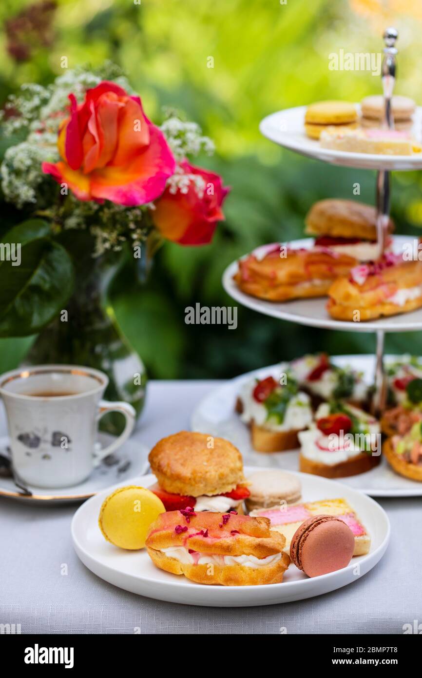 Traditional afternoon tea with canapes and cakes Stock Photo - Alamy